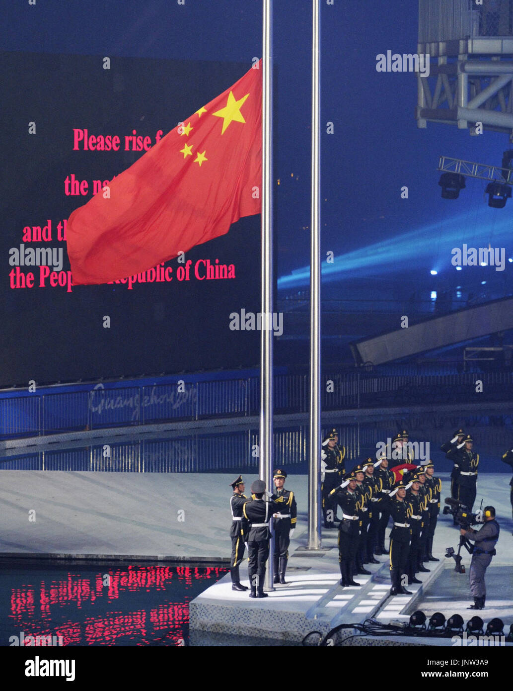 GUANGZHOU, China - The Chinese flag is hoisted during the opening ...