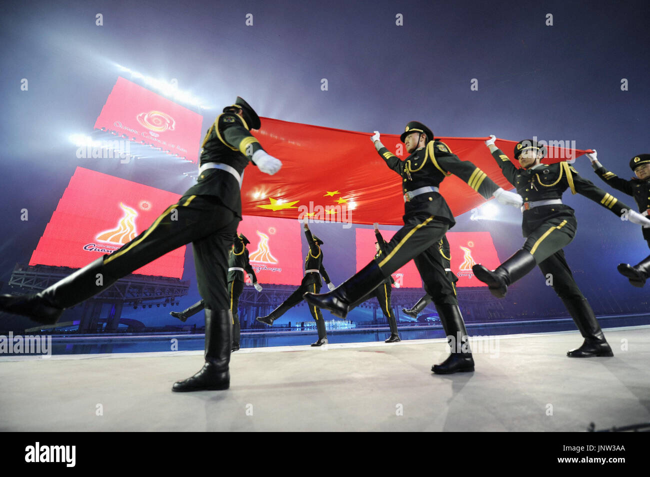 GUANGZHOU, China - The Chinese flag is carried during the Asian Games ...