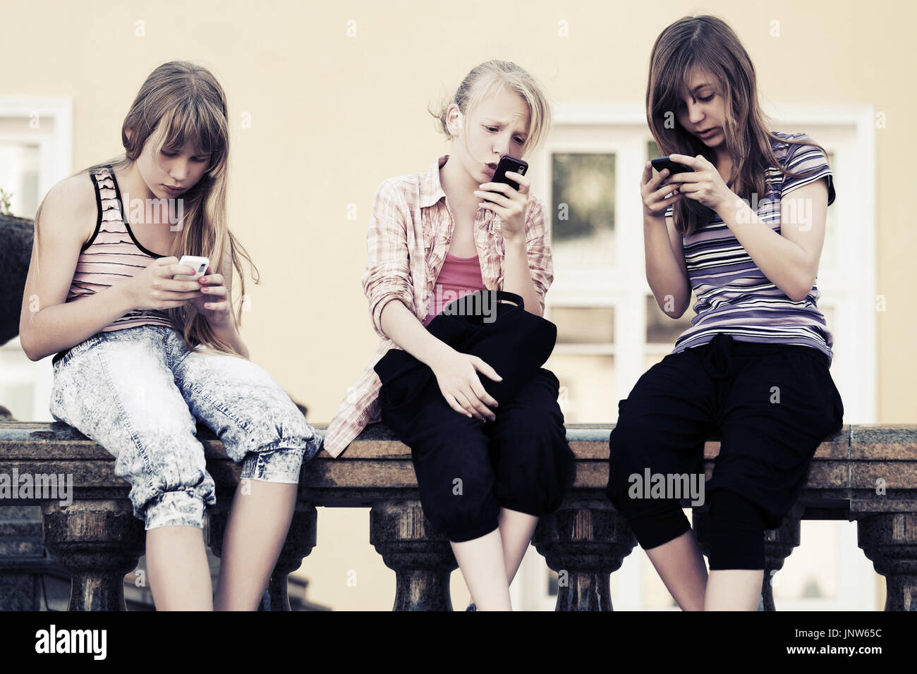 Teenage girls calling on the cell phones Stock Photo - Alamy