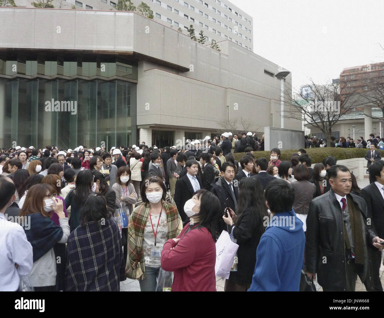 SENDAI, Japan - People escaping buildings to the streets in Sendai ...