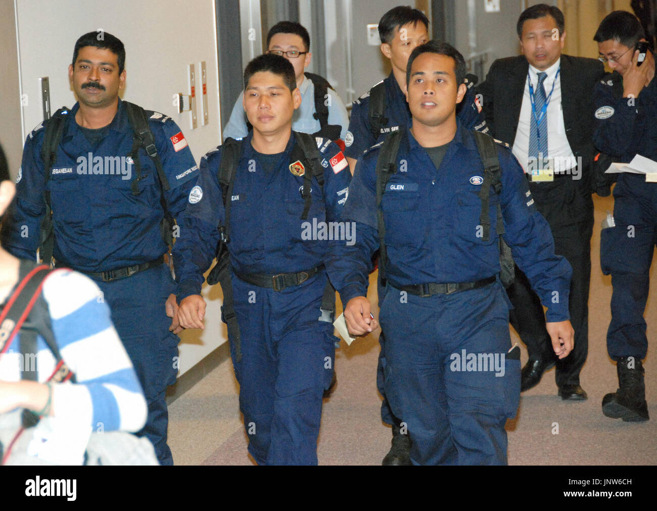 NARITA, Japan - Rescue workers from Singapore arrive at Narita airport ...