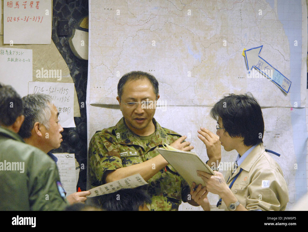 FUKUSHIMA, Japan - Members of an emergency task force at the Fukushima ...
