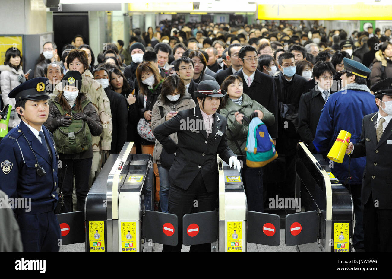 TOKYO, Japan - People wait in lines to board trains at JR Shinjuku ...
