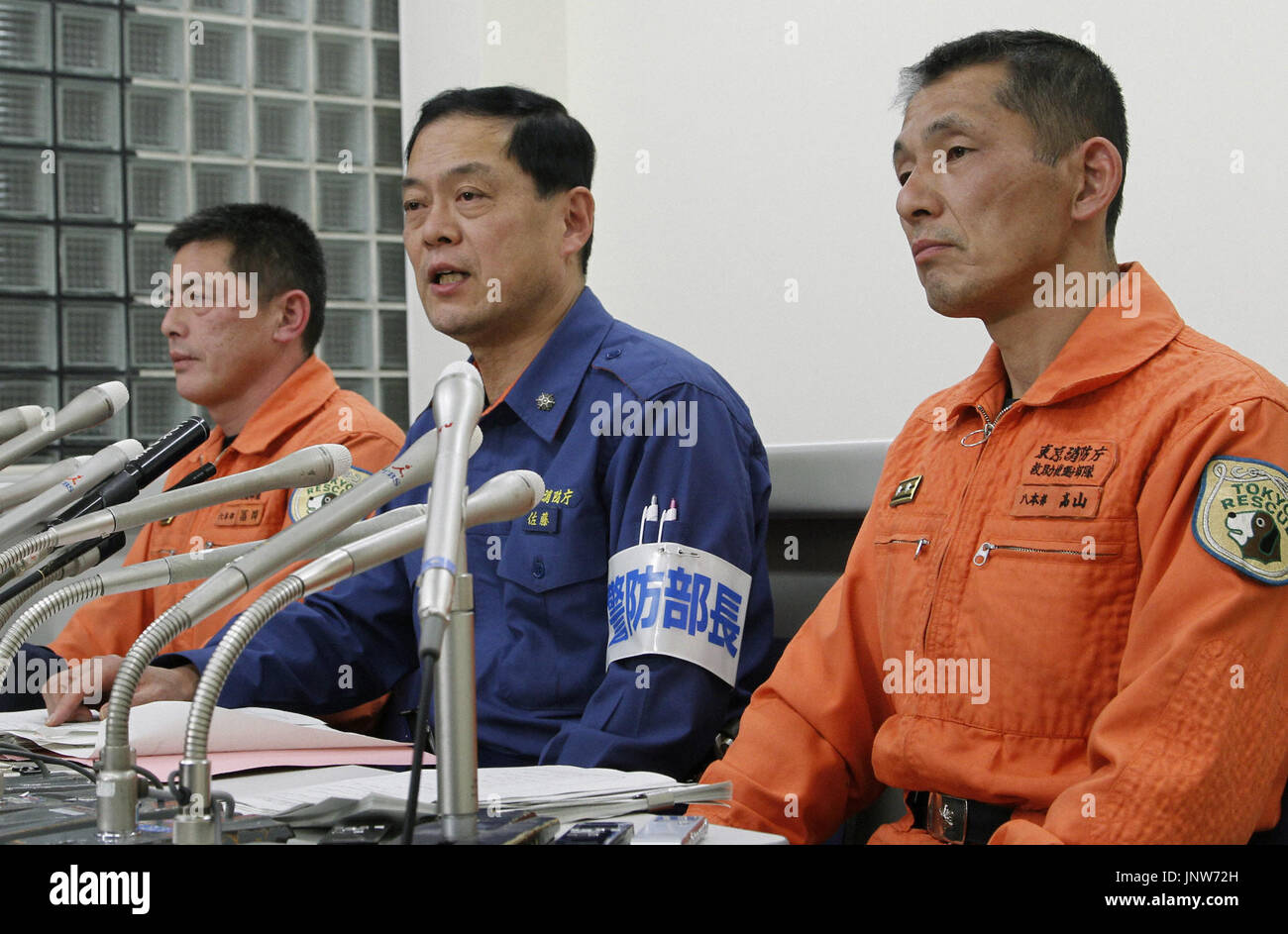 TOKYO, Japan - Tokyo Fire Department rescue squad chiefs Yasuo Sato (C ...