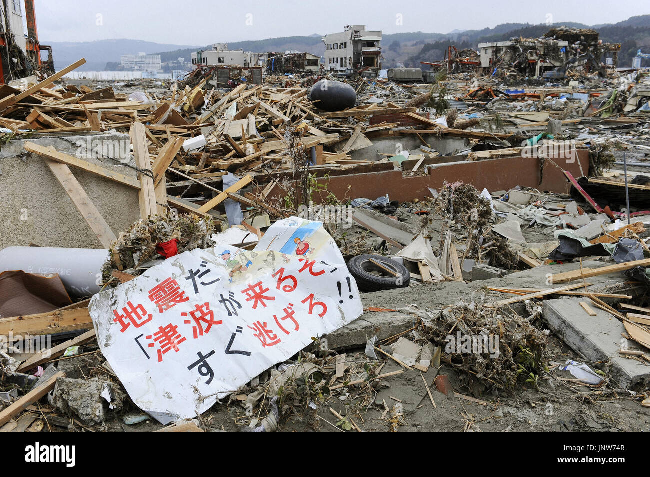 MINAMISANRIKU, Japan - A signboard warning of tsunami following an ...