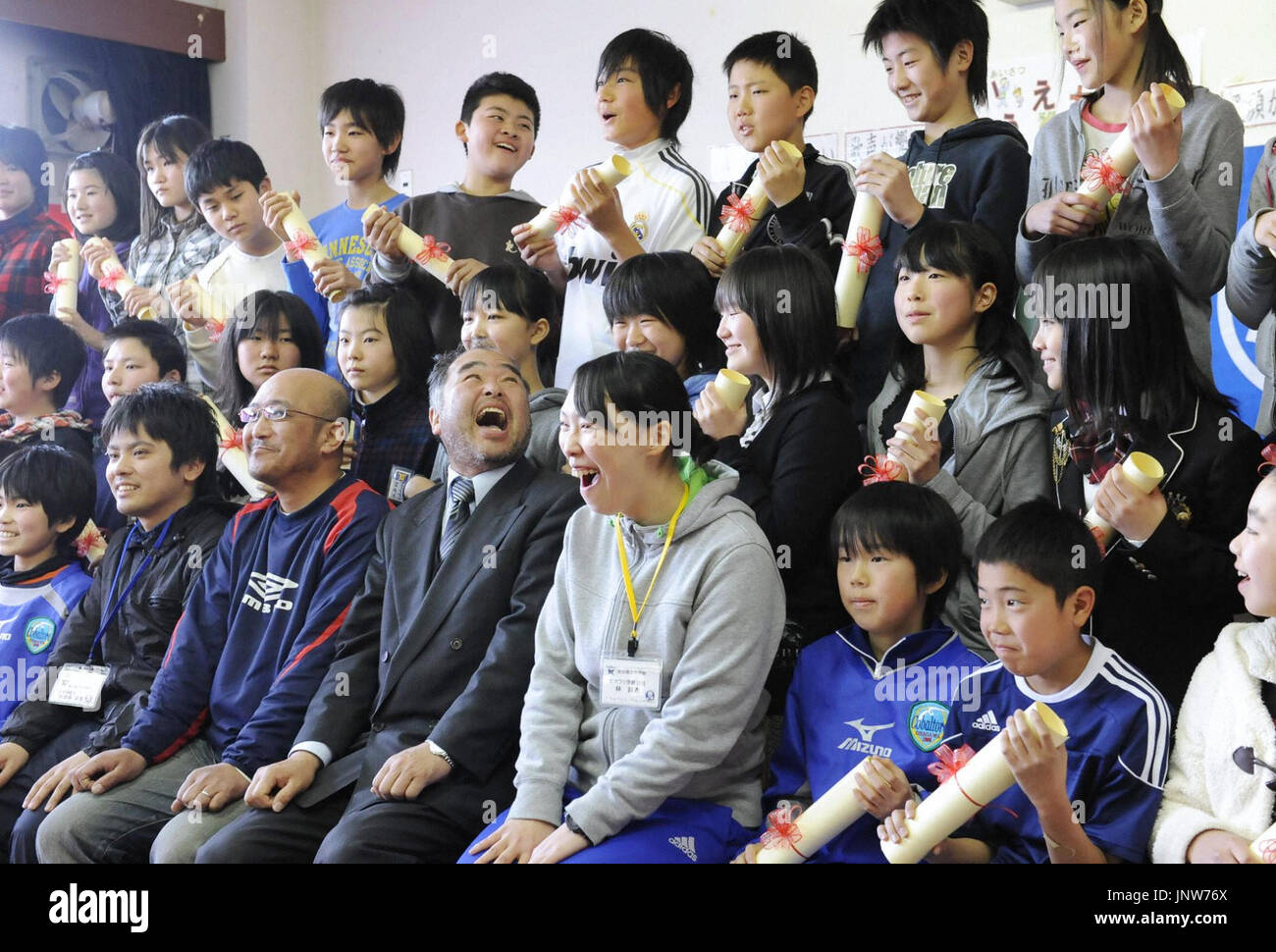 ONAGAWA, Japan - Sixth graders with their certificates of graduation in ...