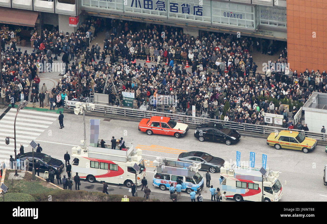 TOKYO, Japan - Voters in Tokyo listen to a candidate's speech in front ...