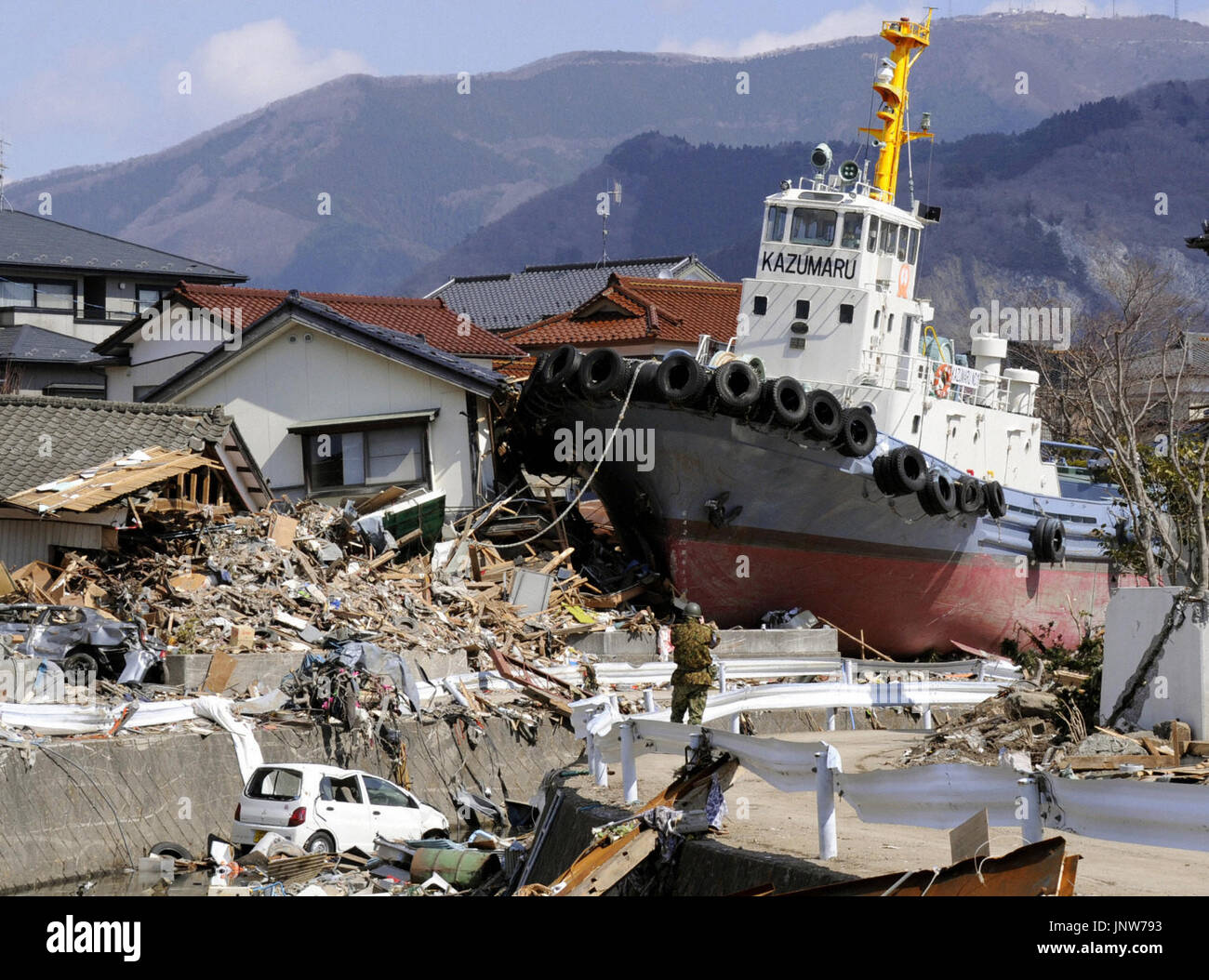 OFUNATO, Japan - A ship is left stranded in a residential area after ...