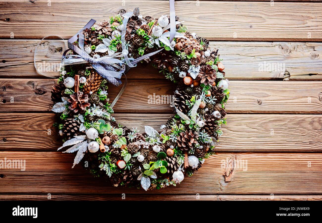 Christmas wreath on wooden rustic background. Space for text. Merry ...