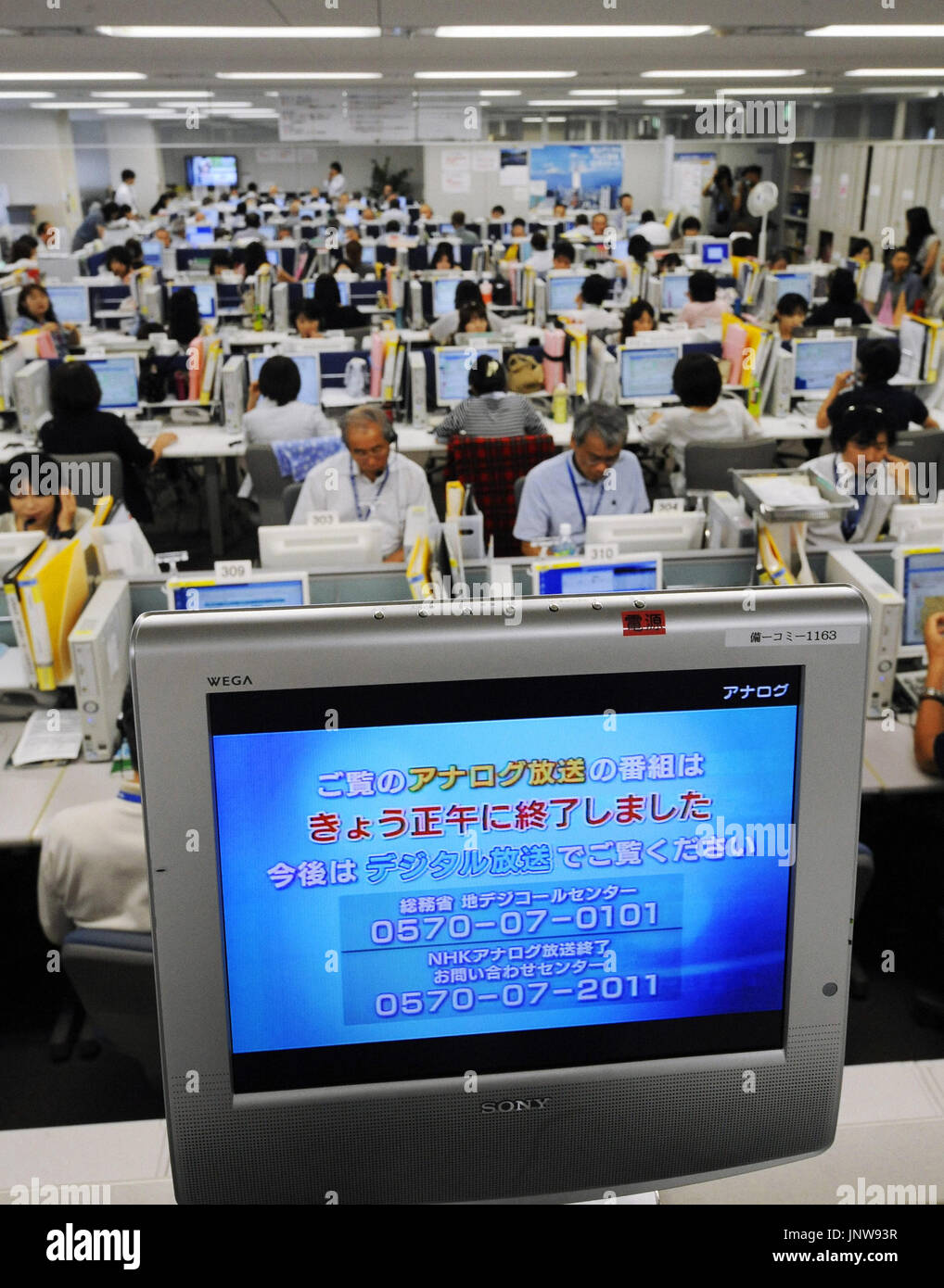 TOKYO, Japan - A TV screen at a communications ministry call center in ...