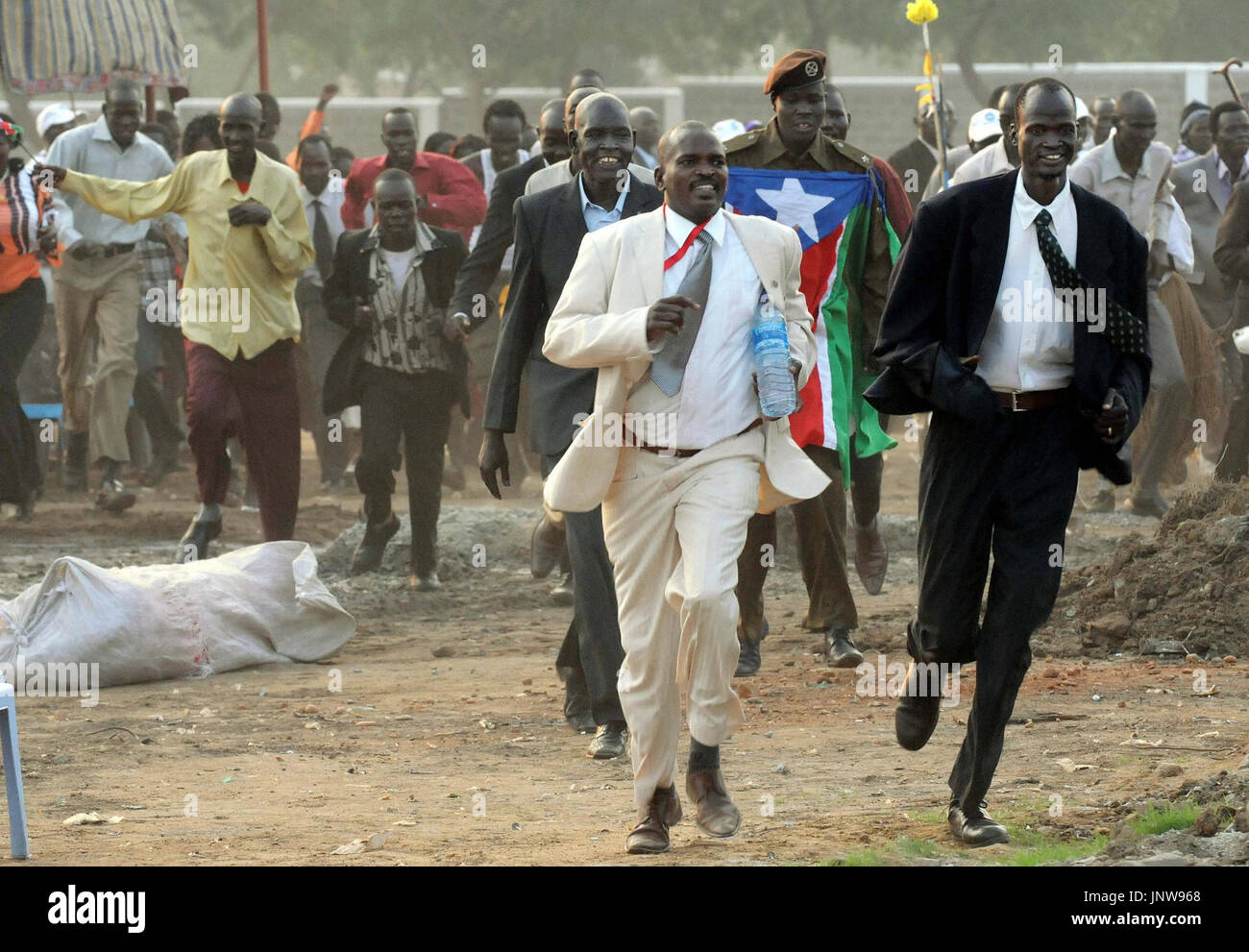 TOKYO, Japan - People run into the venue of the independence ceremony ...