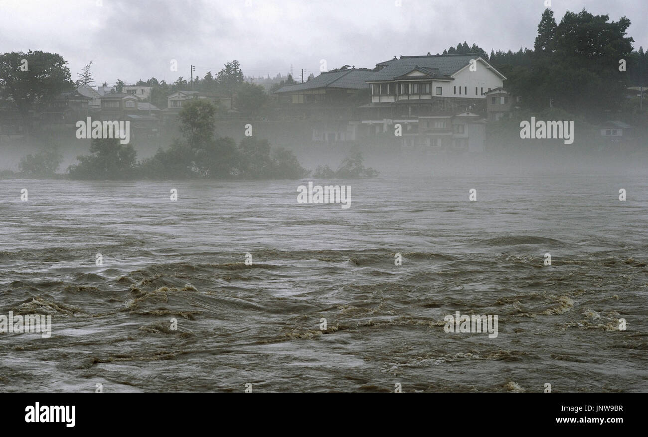 AGA, Japan - The Agano River is swollen due to downpour in the town of ...