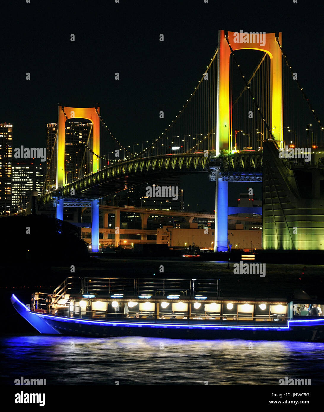TOKYO, Japan - Tokyo's Rainbow Bridge is illuminated with by lights in ...