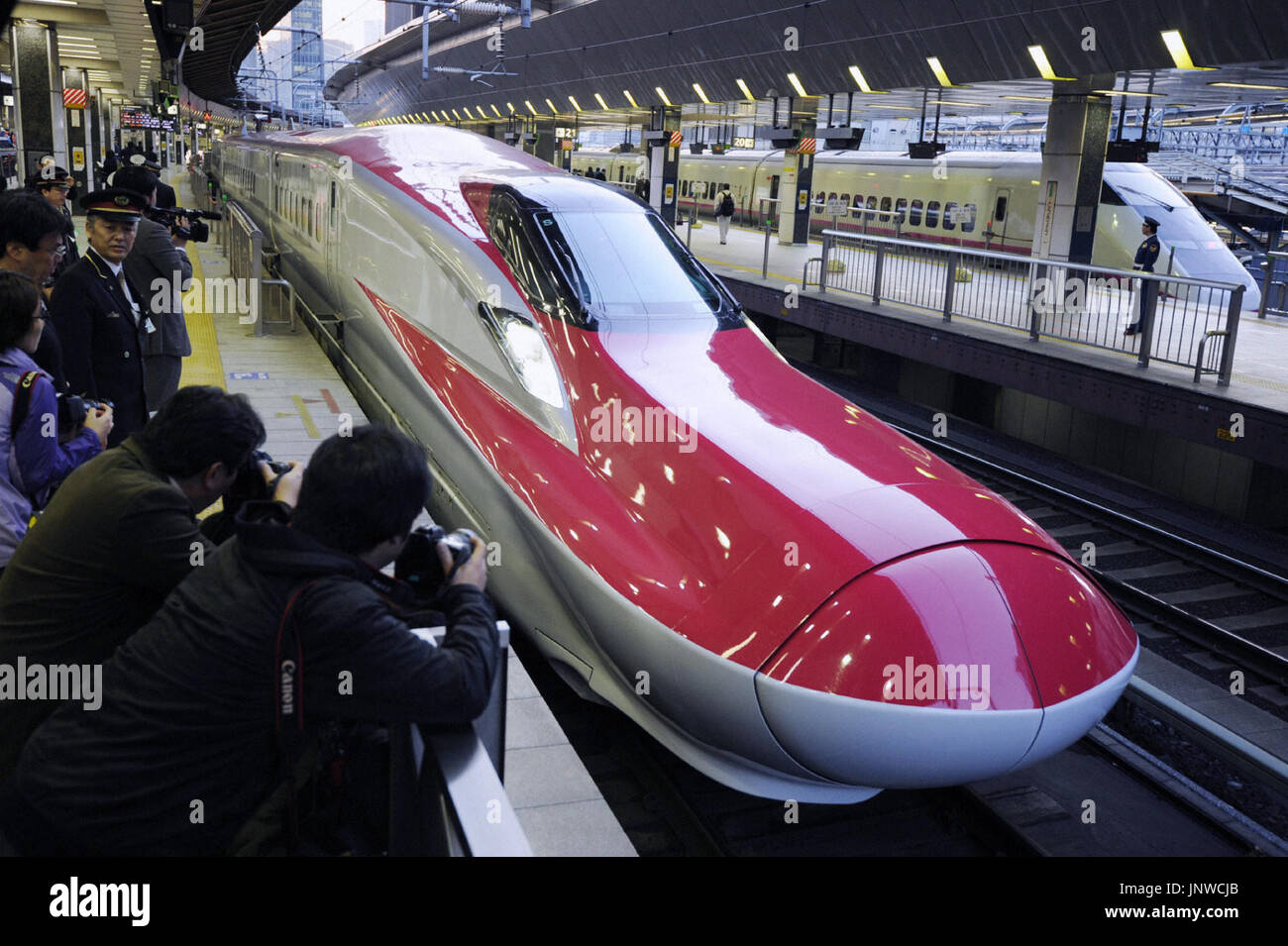 TOKYO, Japan - The E6-type shinkansen bullet train pulls into JR Tokyo ...
