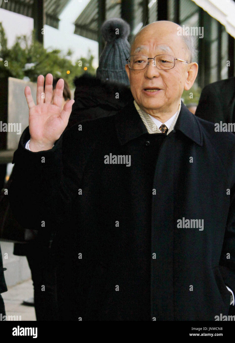 STOCKHOLM, Sweden - Japanese chemist Akira Suzuki waves upon leaving a ...