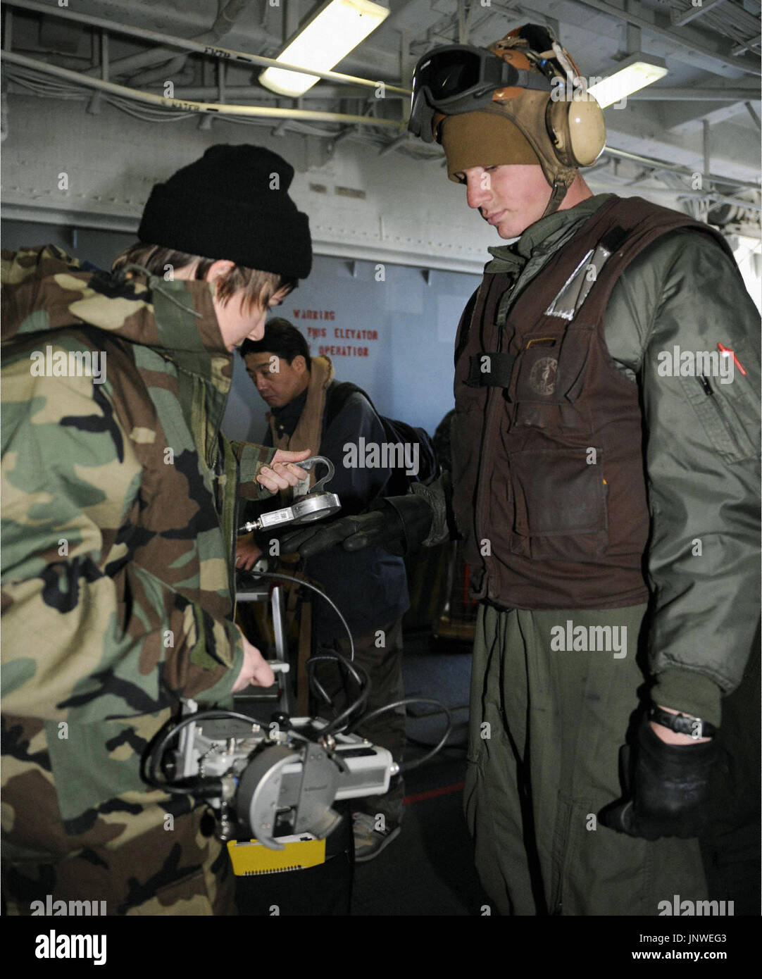 OFF SANRIKU COAST, Japan - A U.S. Navy soldier (R) receives radiation ...