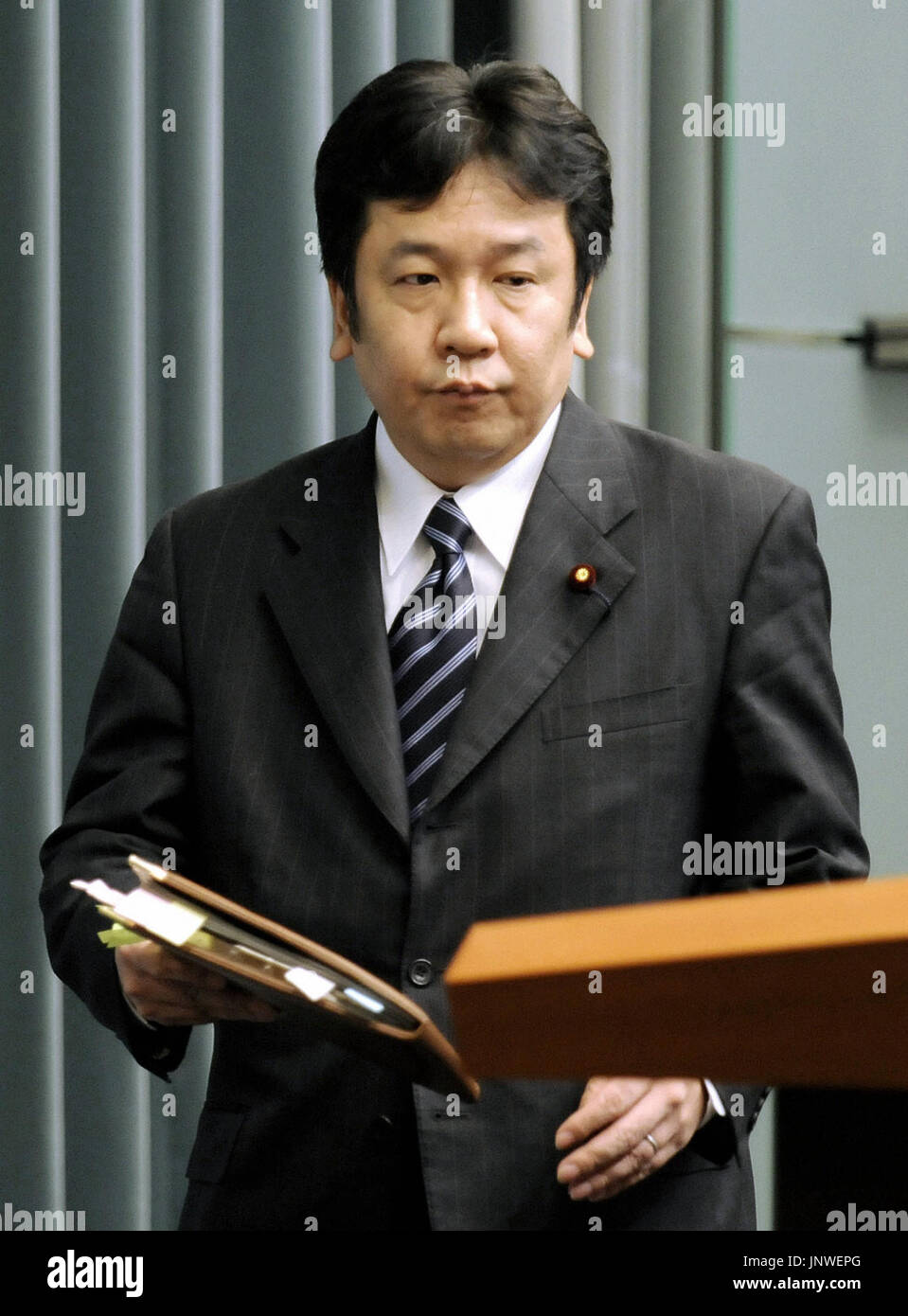 TOKYO, Japan - Chief Cabinet Secretary Yukio Edano, Japan's top government spokesman, attends a ...