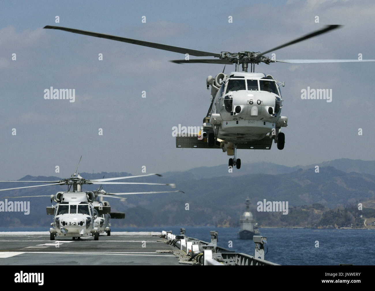 KESENNUMA, Japan - A helicopter takes off from the Maritime Self ...