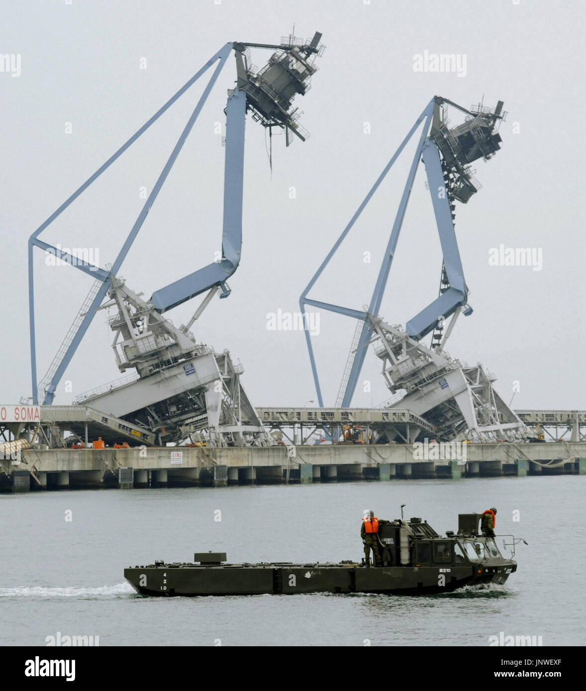 SOMA, Japan - Photo shows port equipment bent by the March 11 ...