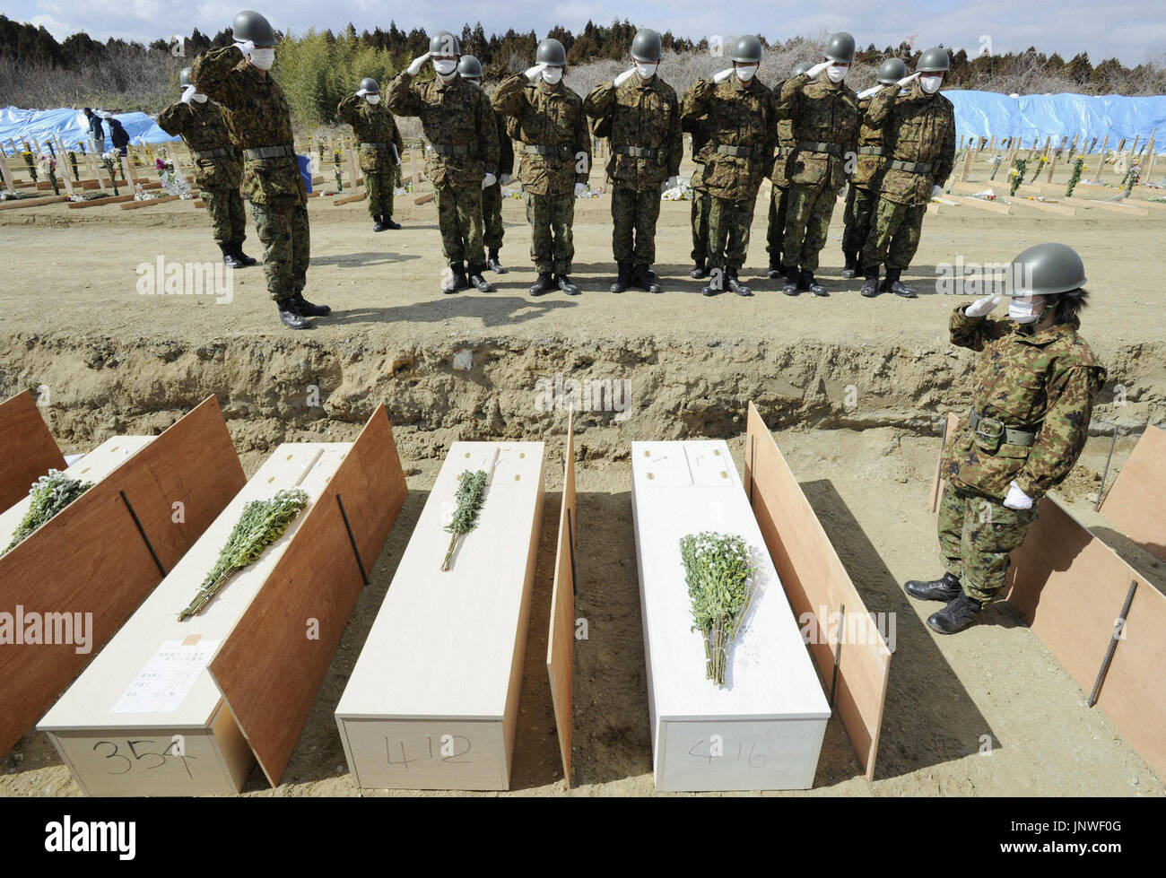 HIGASHIMATSUSHIMA, Japan - Members of the Self-Defense Forces salute ...