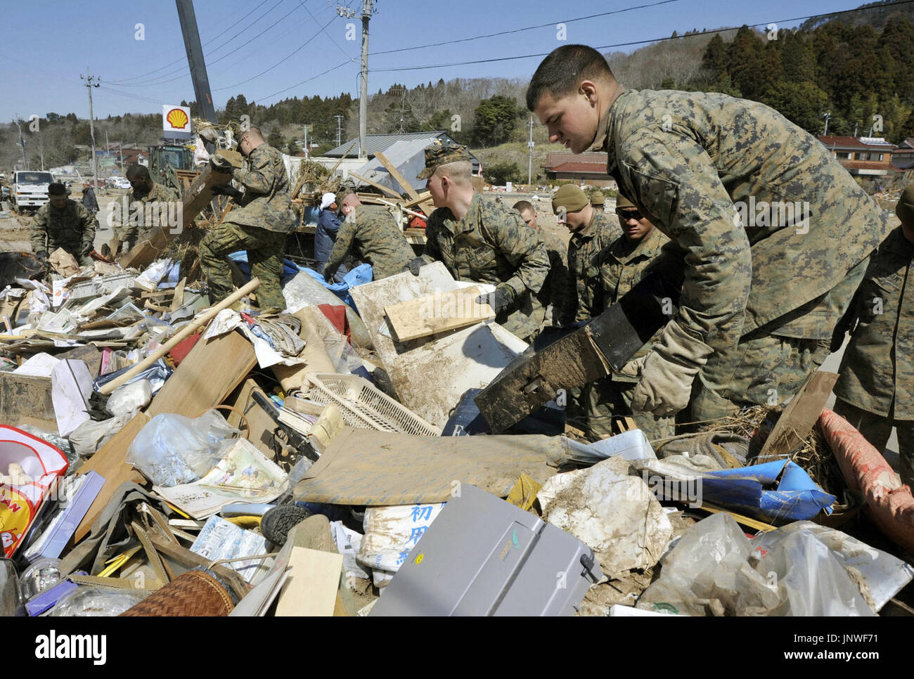 KESENNUMA, Japan - U.S. Marines clean up debris on the quake and ...
