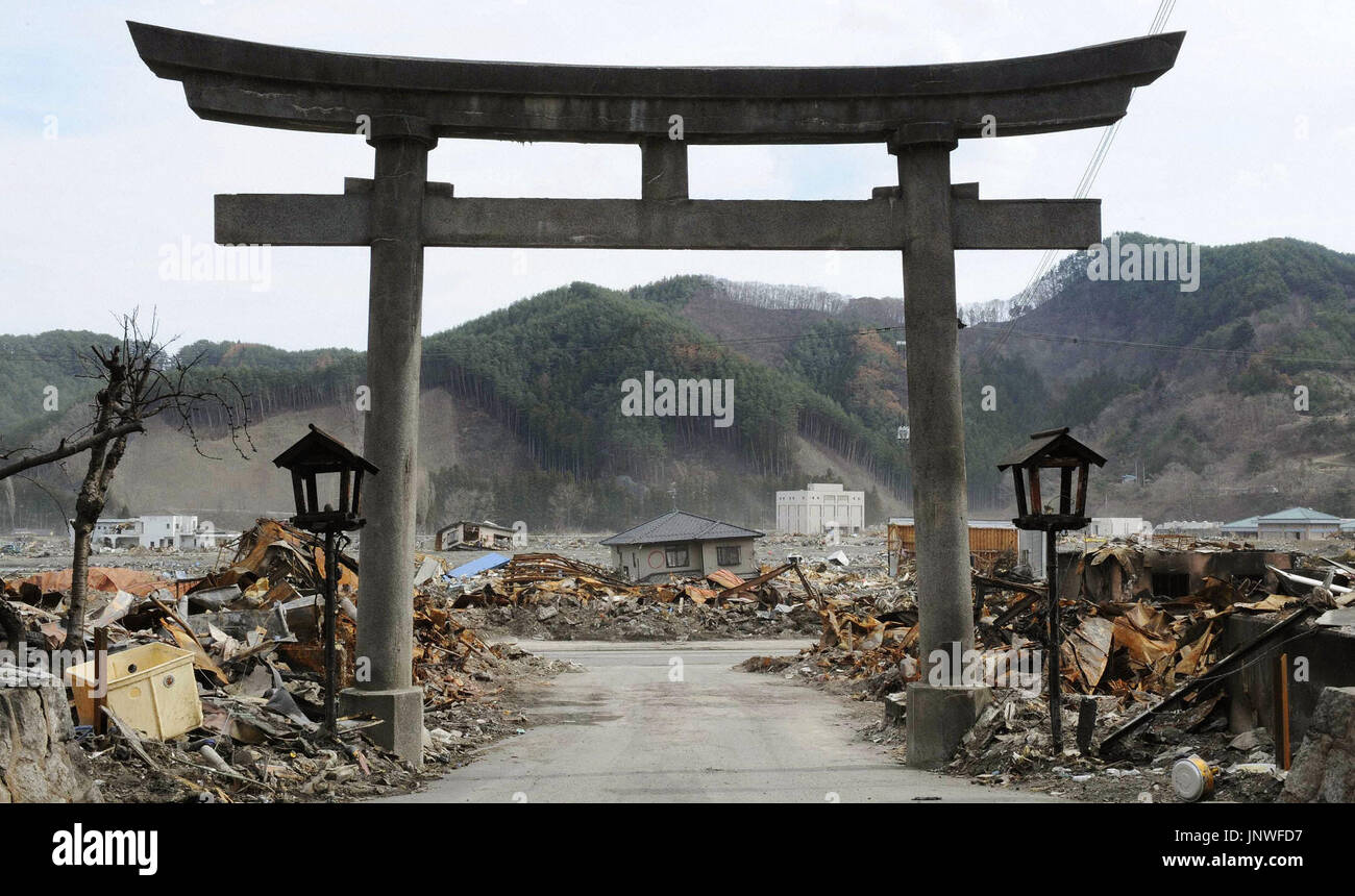 OTSUCHI, Japan - A shrine gate stands among debris in the quake-hit ...