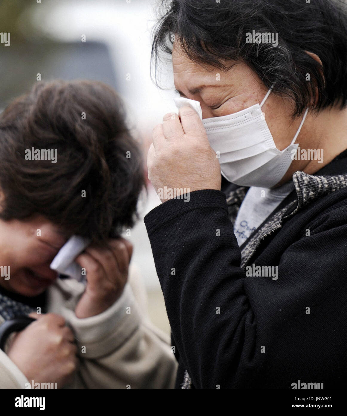 NATORI, Japan - Women cry during a memorial ceremony held for the ...