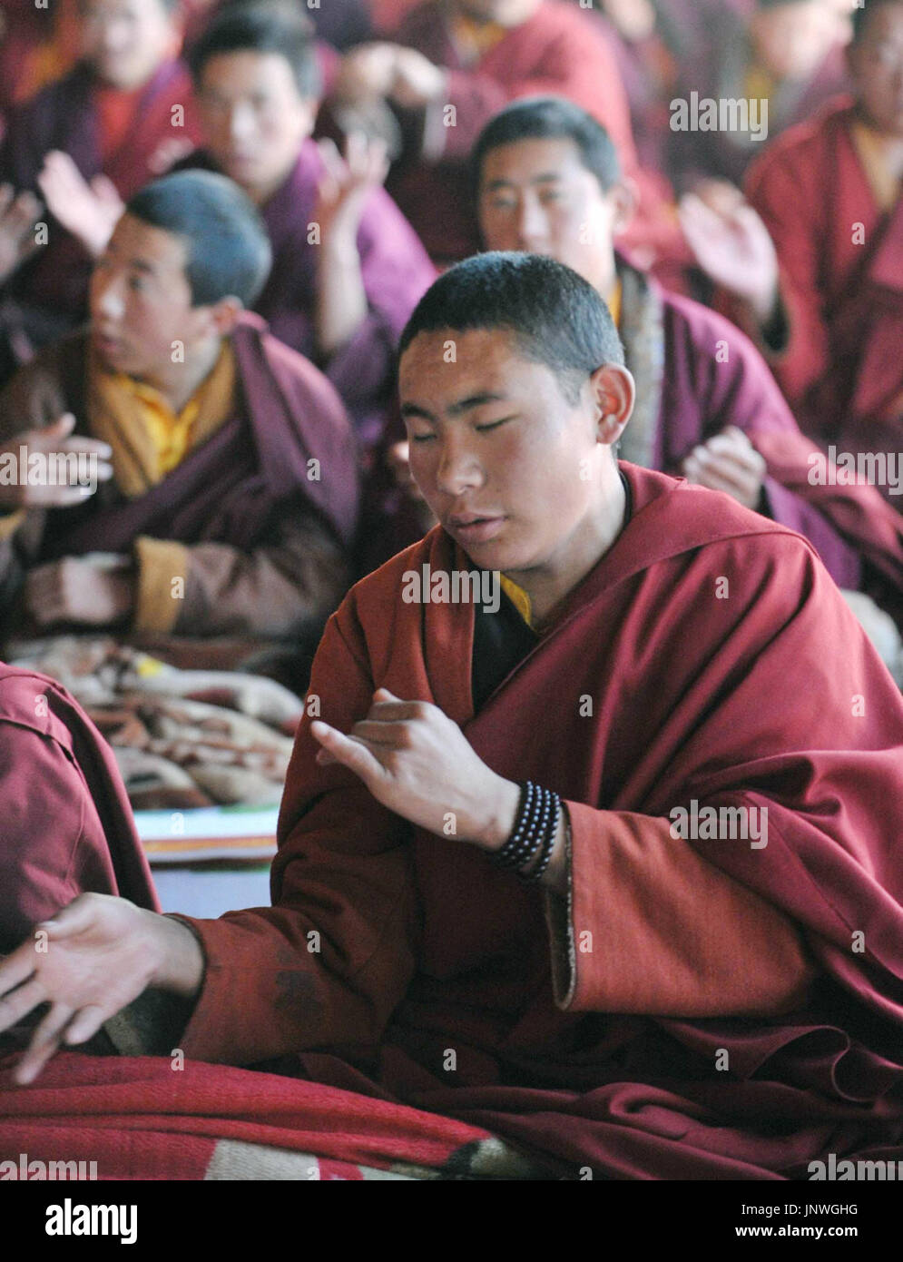 YUSHU, China - Tibetan monks chant Buddhist invocations in Yushu ...