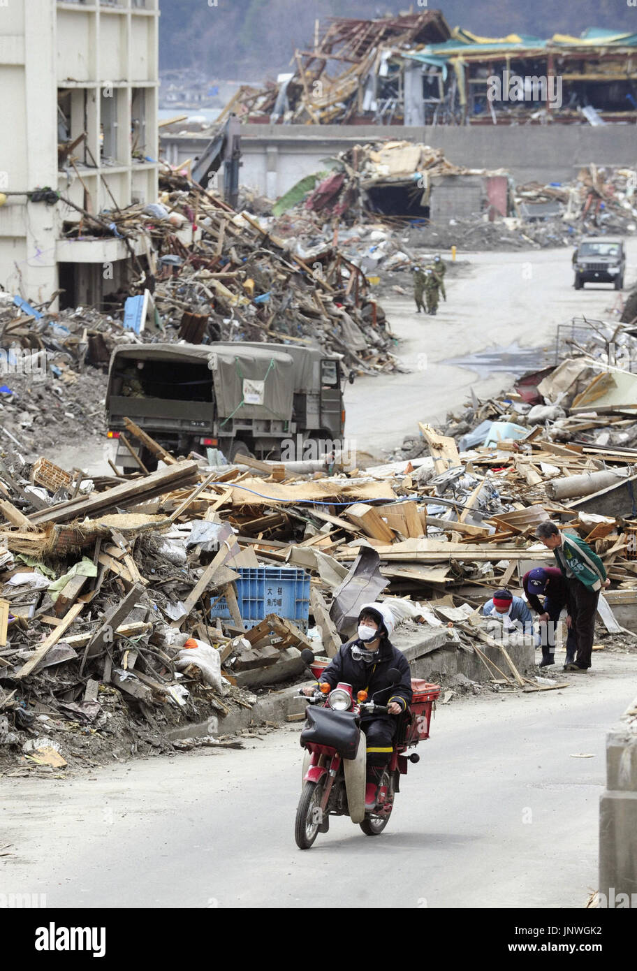 OTSUCHI, Japan - A mailman rides on a motorcycle on April 16, 2011, in ...