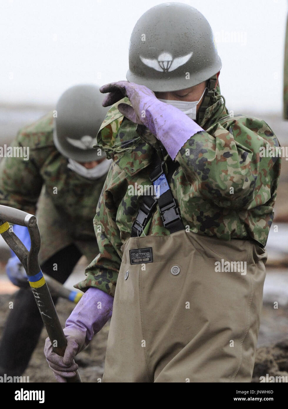 MINAMISOMA, Japan - Members of the Self-Defense Forces search for ...