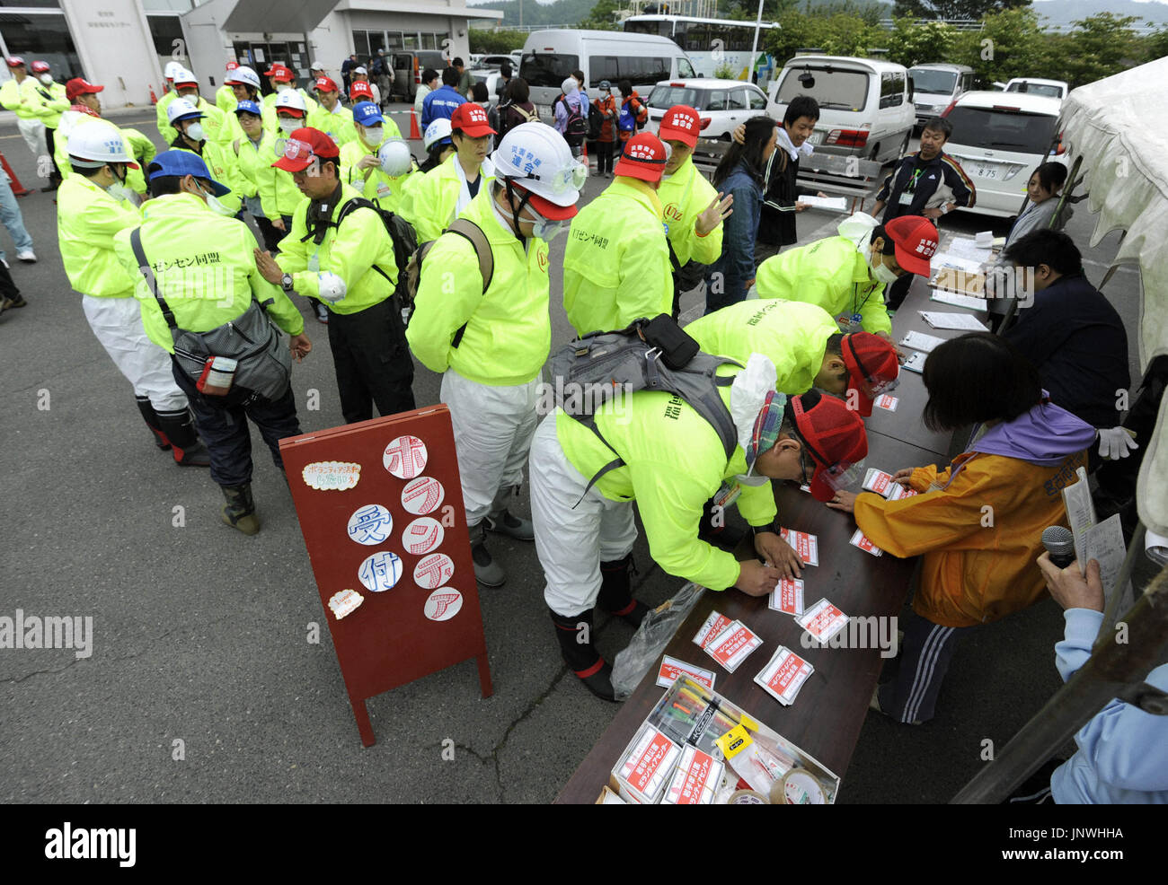 SENDAI, Japan - People register as volunteers to engage in work related ...