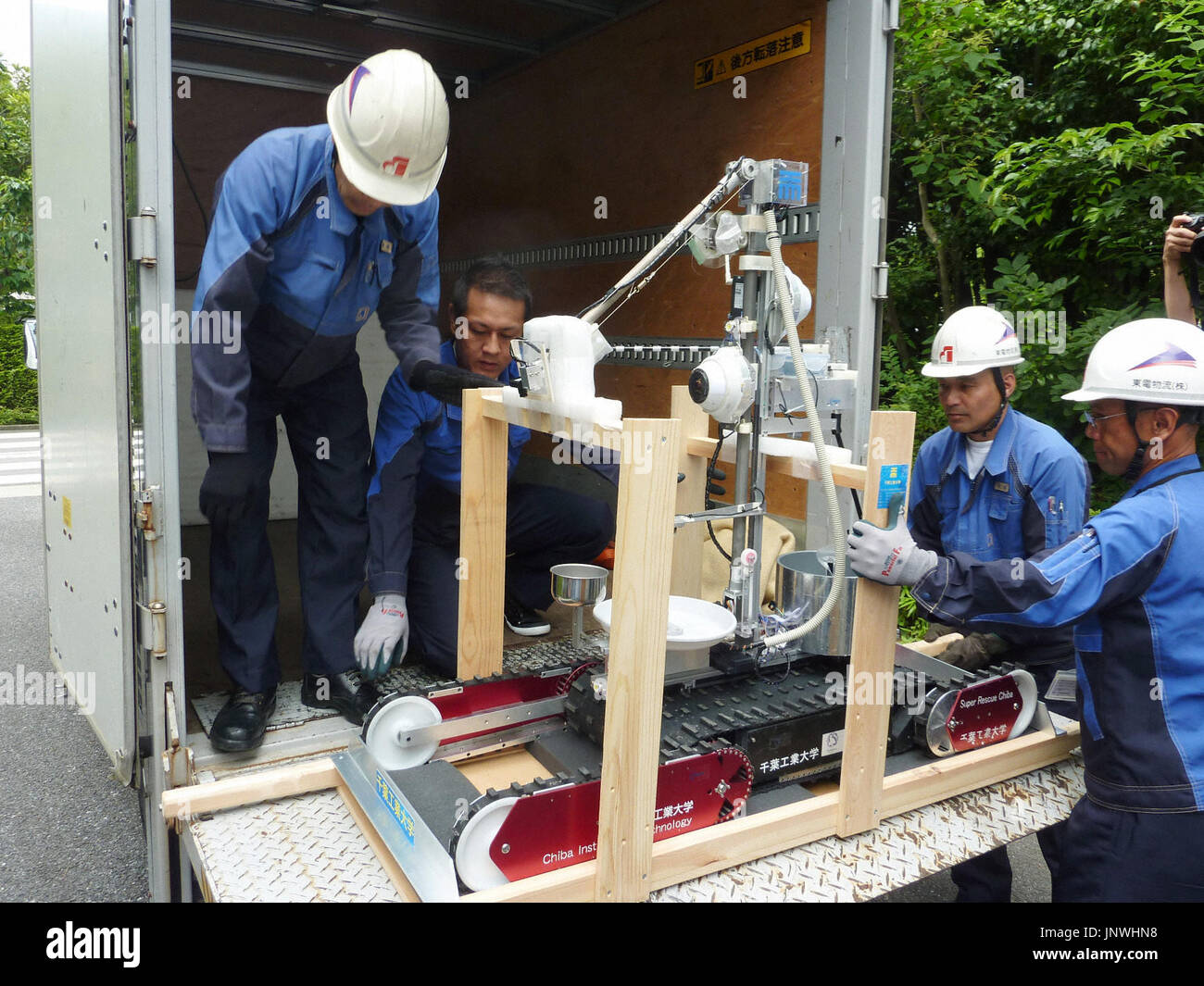 CHIBA, Japan - A robot ''Quince' is loaded onto a truck at Chiba ...