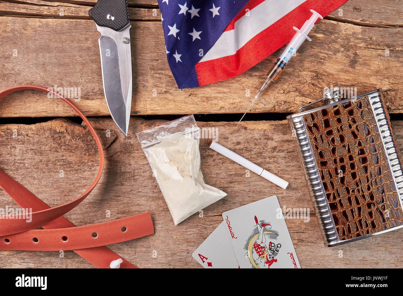 Narcotics, alcohol, knife, american flag Stock Photo - Alamy