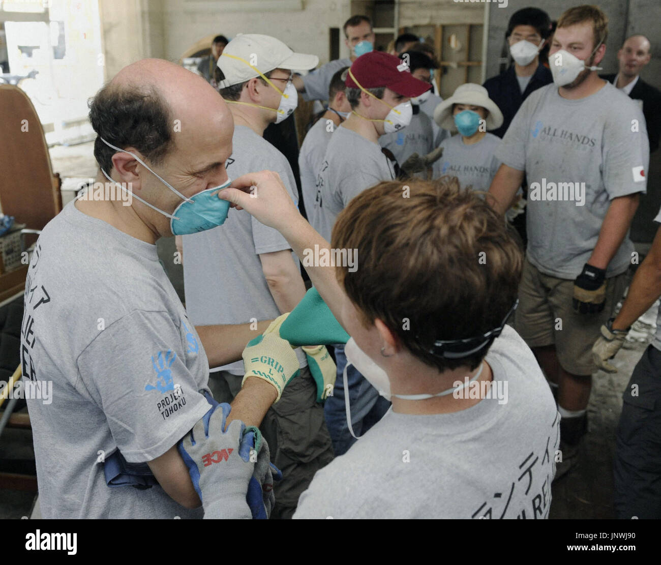 OFUNATO, Japan - U.S. Ambassador to Japan John Roos (L) receives a mask ...