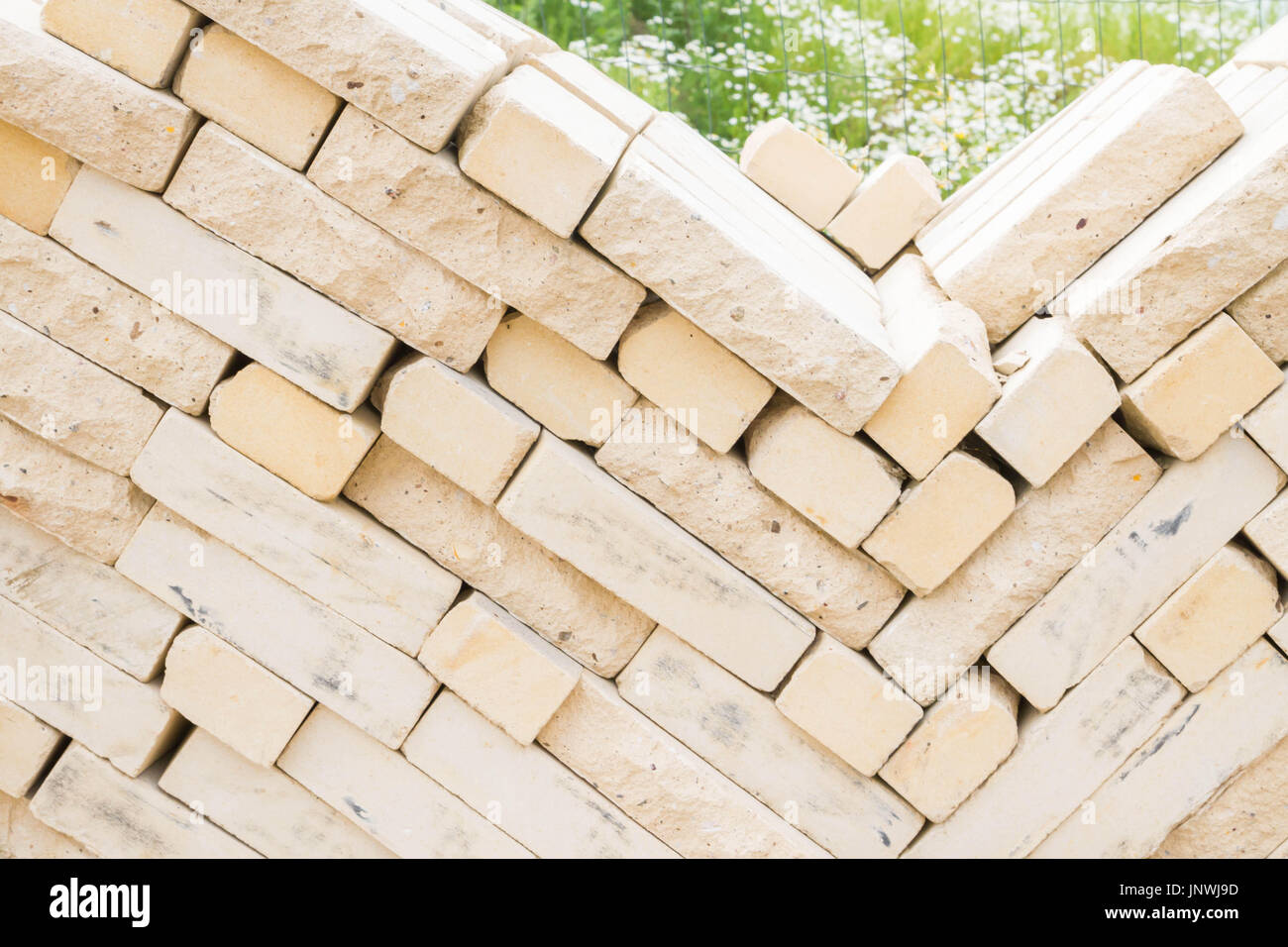 The yellow brick building material for sale in shop Stock Photo - Alamy