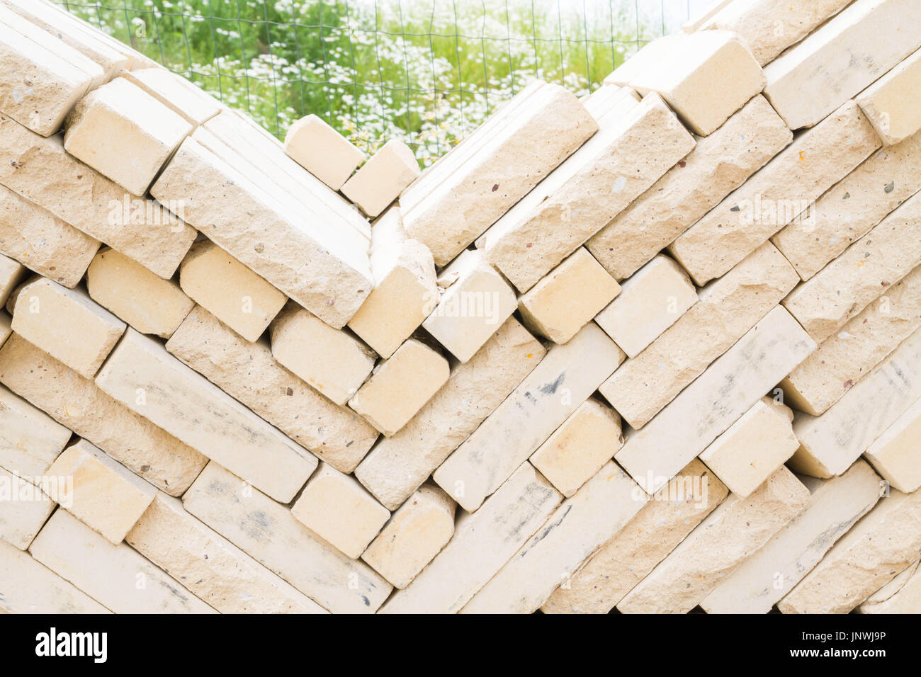 The yellow brick building material for sale in shop Stock Photo - Alamy