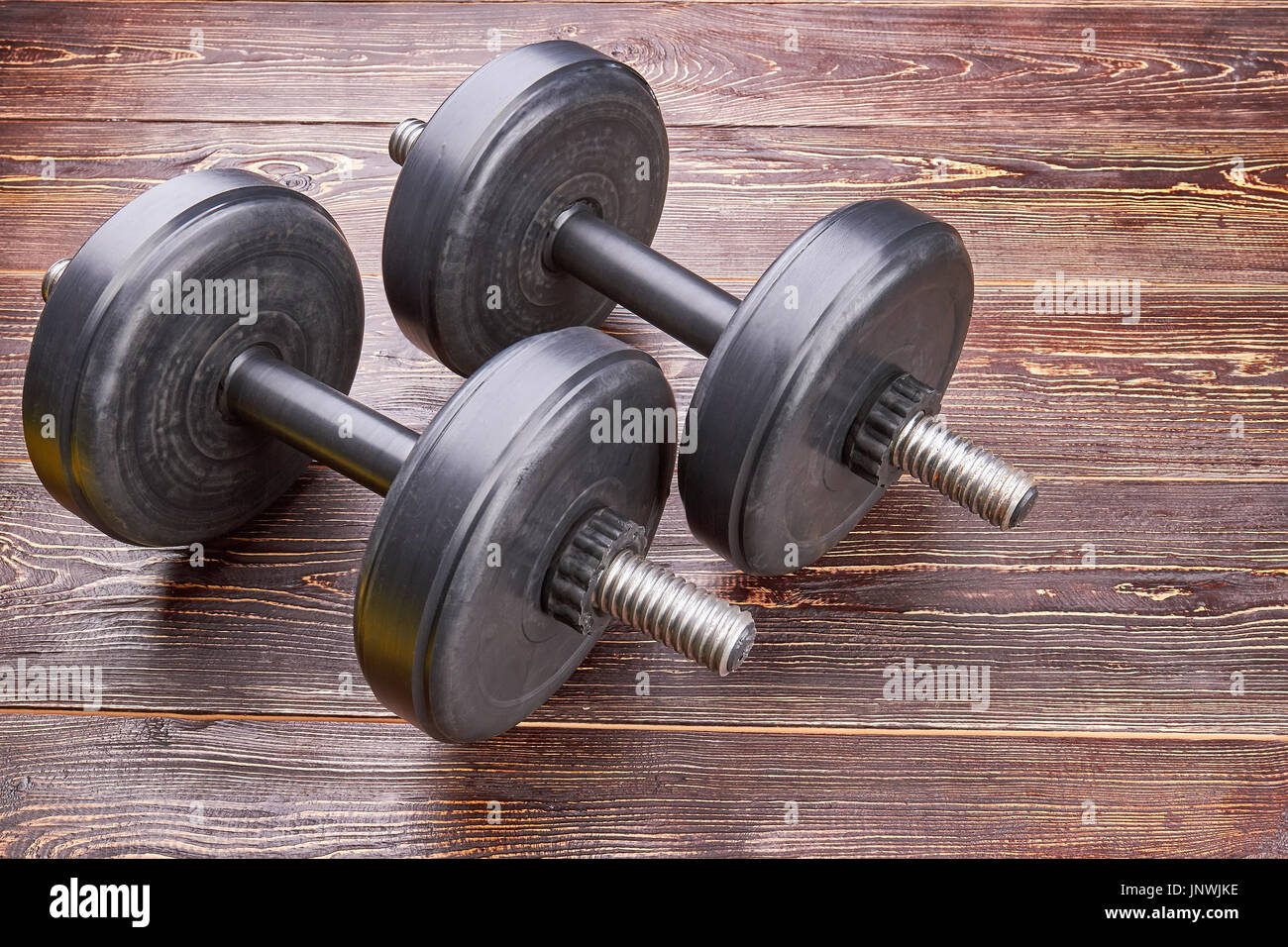 Two dumbbells on wooden hi-res stock photography and images - Alamy