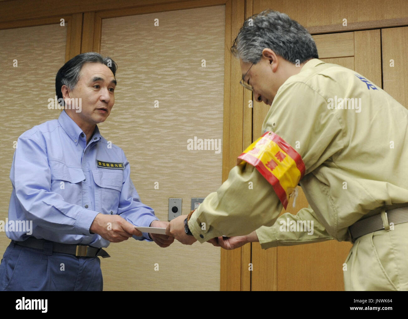 MORIOKA, Japan - Japan's new reconstruction minister Tatsuo Hirano (L ...