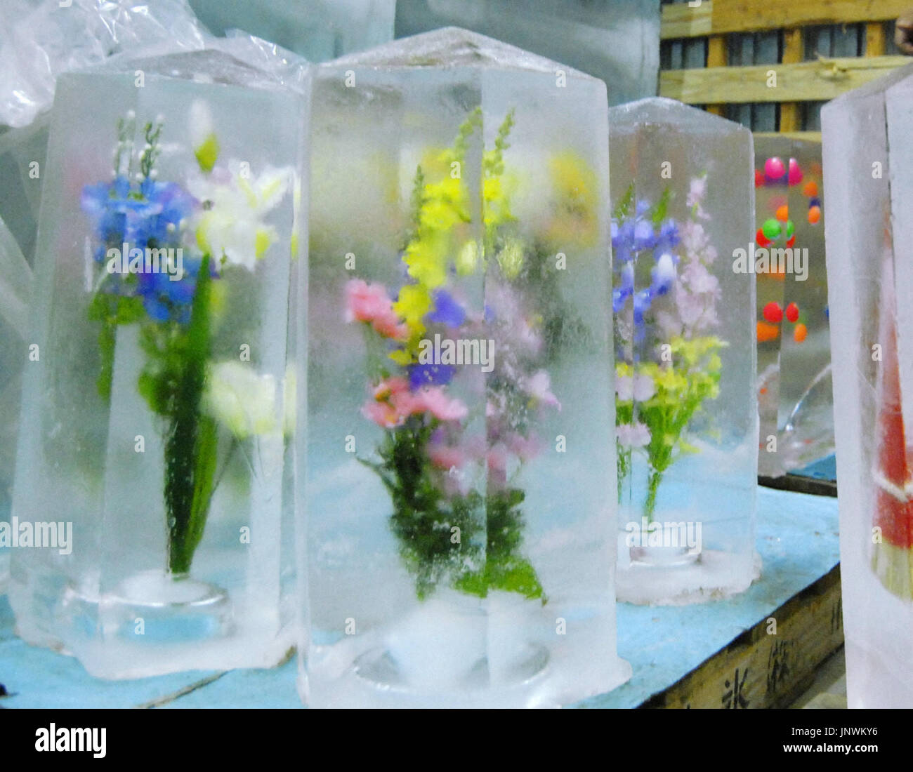 FUKUOKA, Japan - Photo shows artificial flowers in columns of ice sold ...