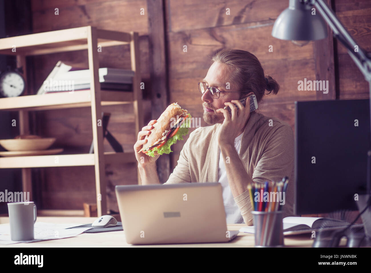 Business man holding sandwich hi-res stock photography and images - Alamy
