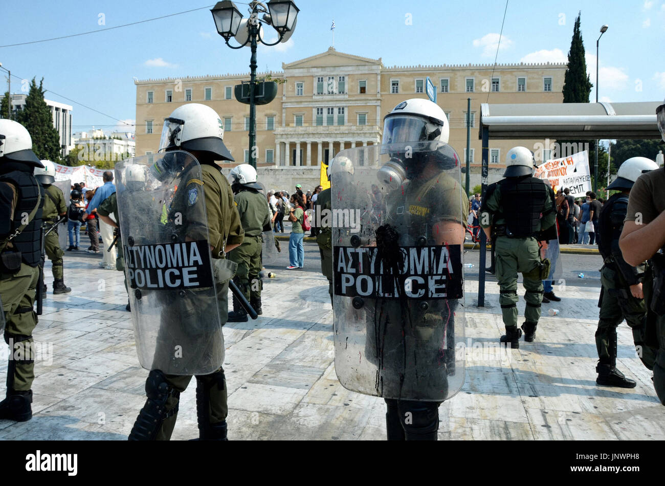 ATHENS, Greece - Riot police officers keep watch near the Greek ...