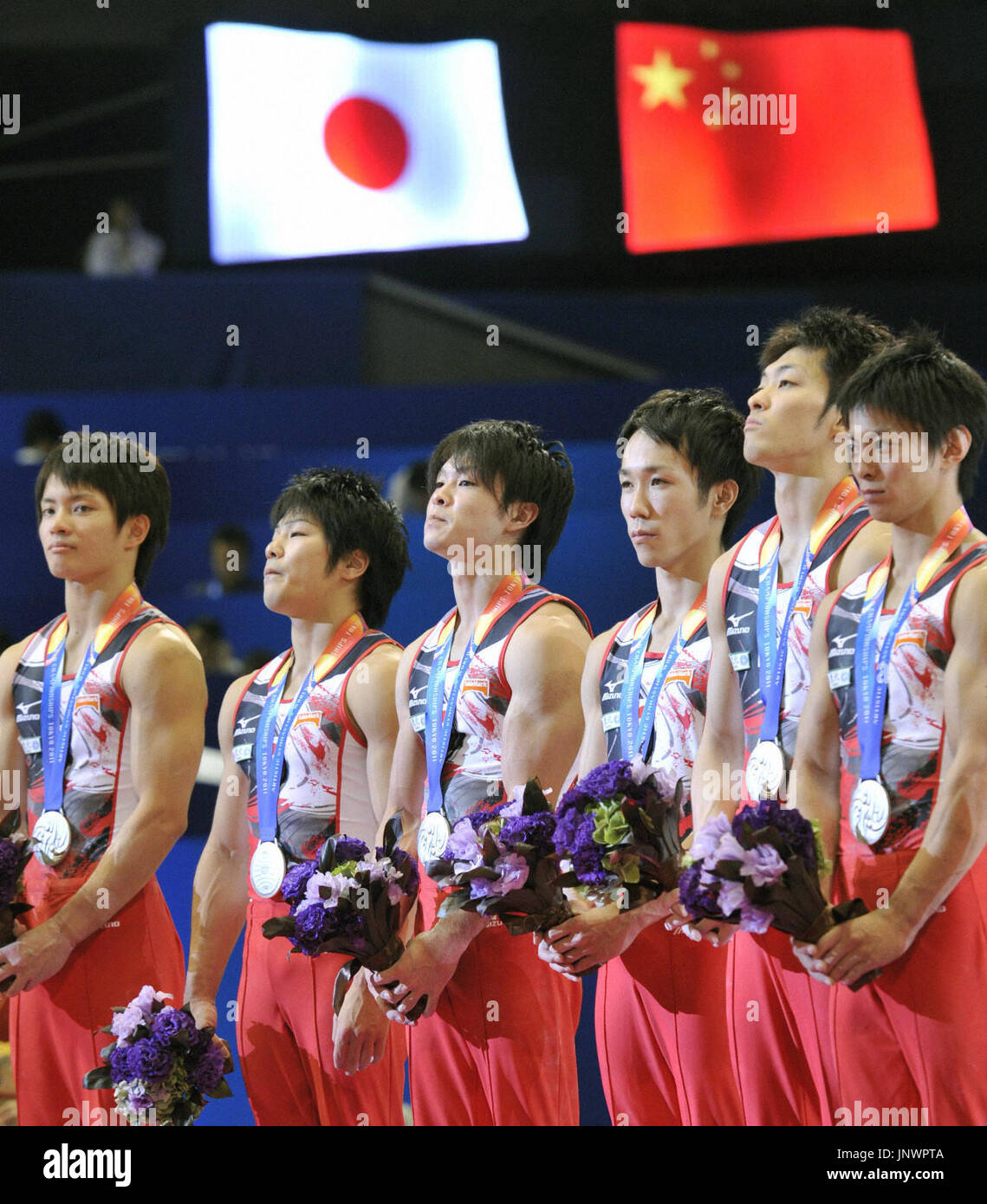 TOKYO, Japan - Members of the Japanese team wear their silver medals ...