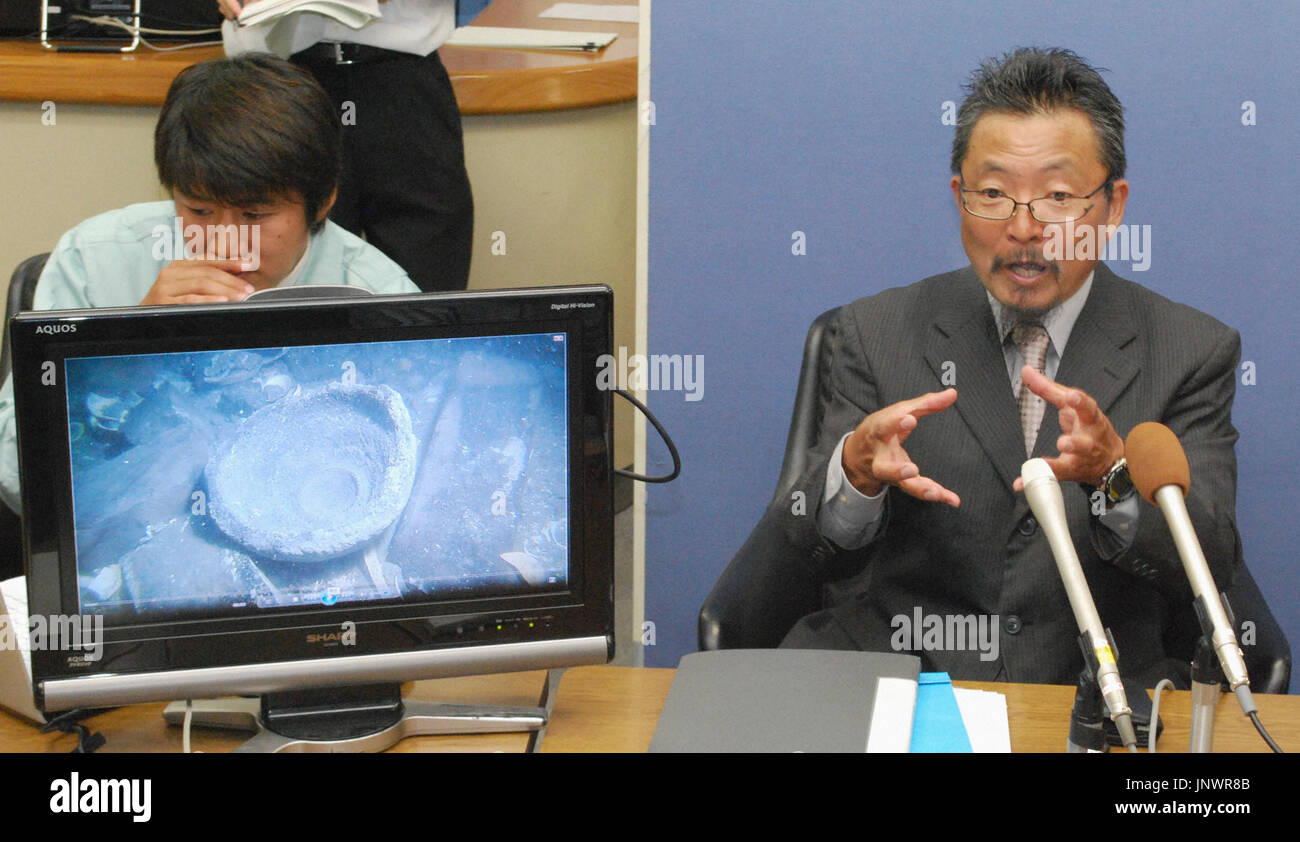 NAGASAKI, Japan - Yoshifumi Ikeda (R), a professor at the University of ...