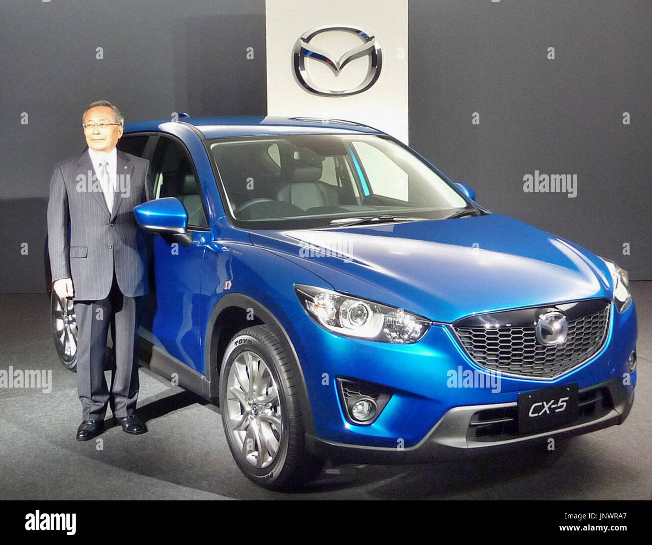 TOKYO, Japan - Mazda Motor Corp. President Takashi Yamanouchi presents ...