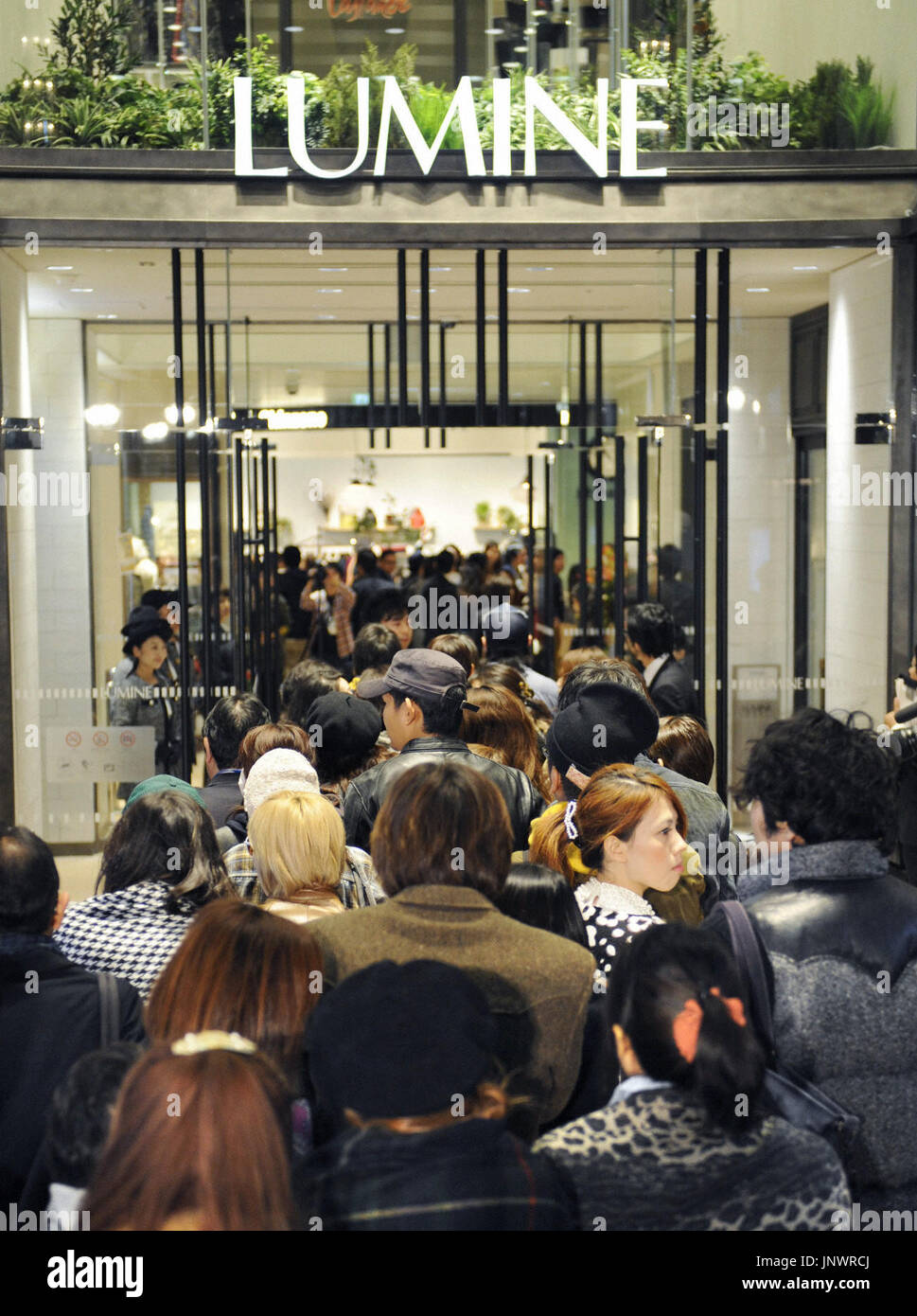 TOKYO, Japan - Customers enter the Yurakucho branch of Lumine Co., a ...