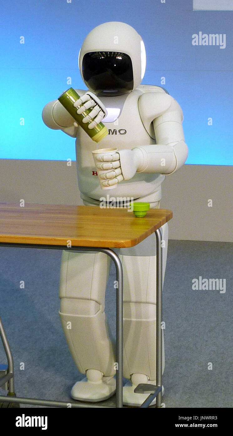 TOKYO, Japan - An all-new ASIMO humanoid robot, unveiled by Honda Motor ...