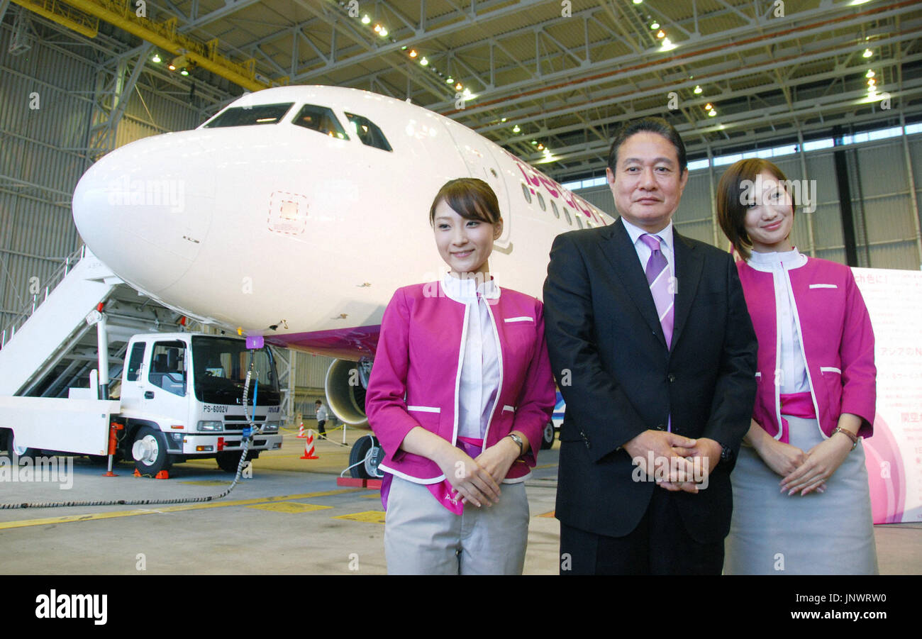 OSAKA, Japan - Peach Aviation Ltd. CEO Shinichi Inoue (C) poses for ...