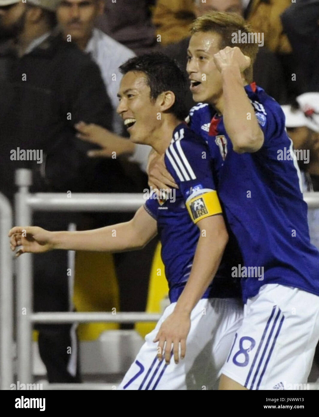 DOHA, Qatar - Japan midfielder Keisuke Honda (R) congratulates Makoto ...