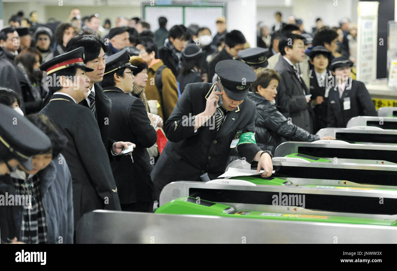 TOKYO, Japan - Employees of East Japan Railway Co. scramble to address ...