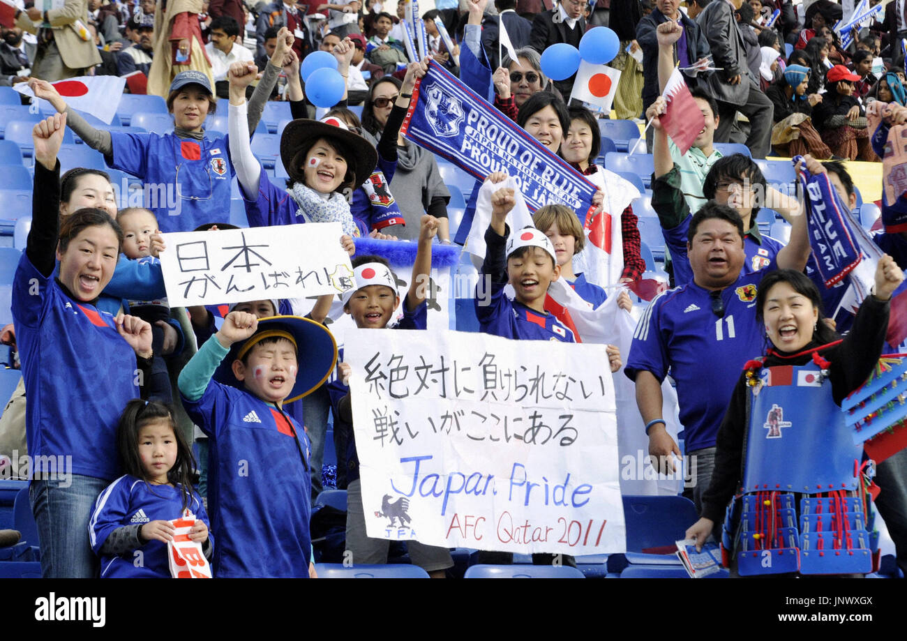 DOHA, Qatar - Supporters cheer for the Japanese soccer team at a ...